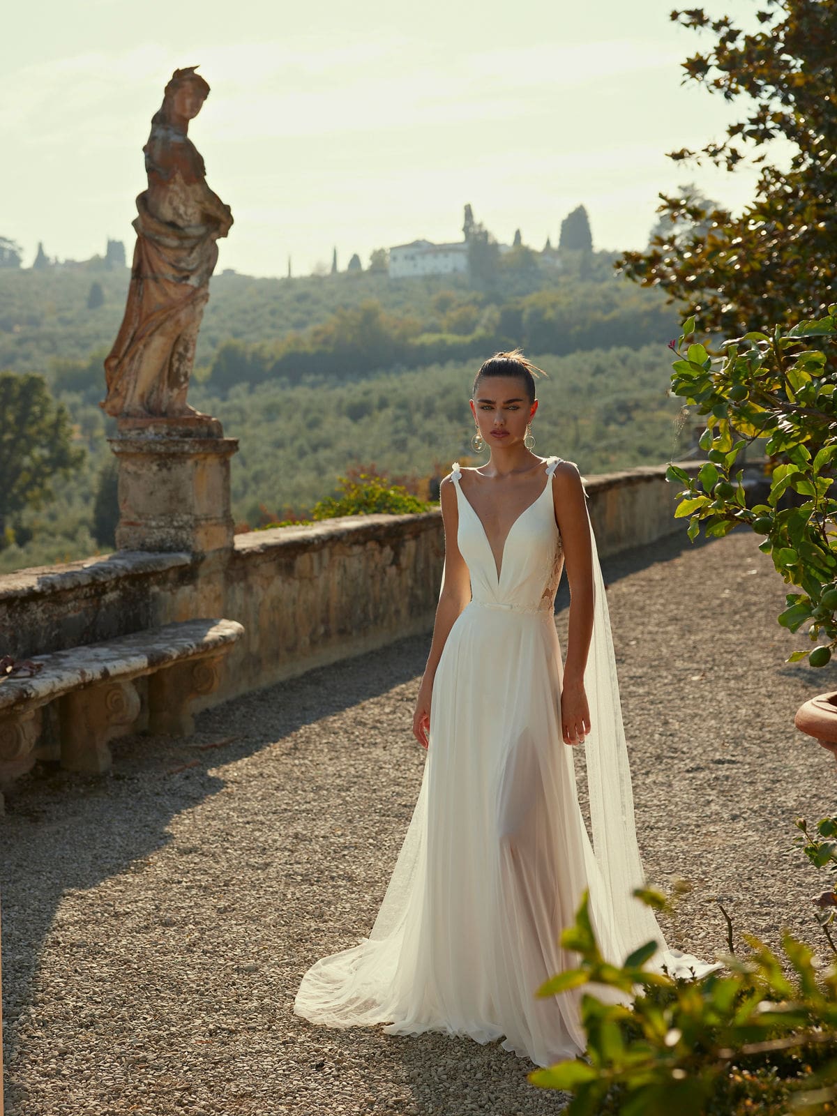 DINA | A-line silhouette with a plunging V-neckline | Modeca